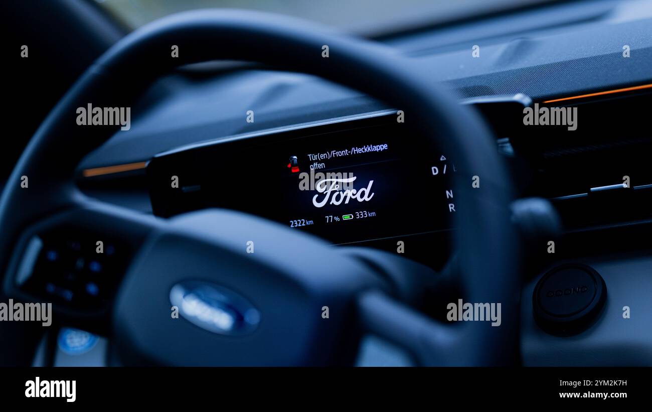 Cologne, Germany. 20th Nov, 2024. The Ford logo lights up on the ...