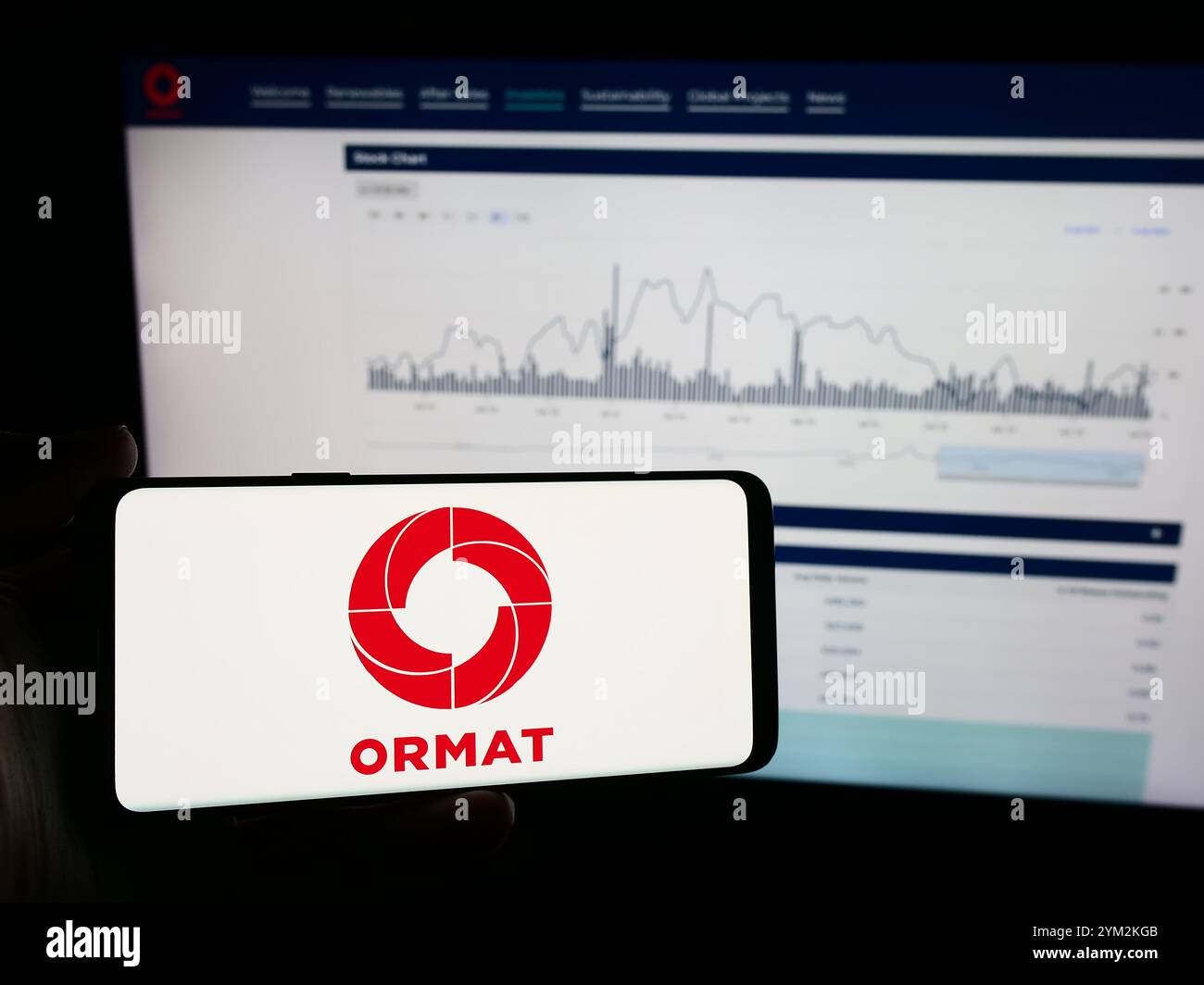 In this photo illustration, a man is holding a mobile phone with the ...