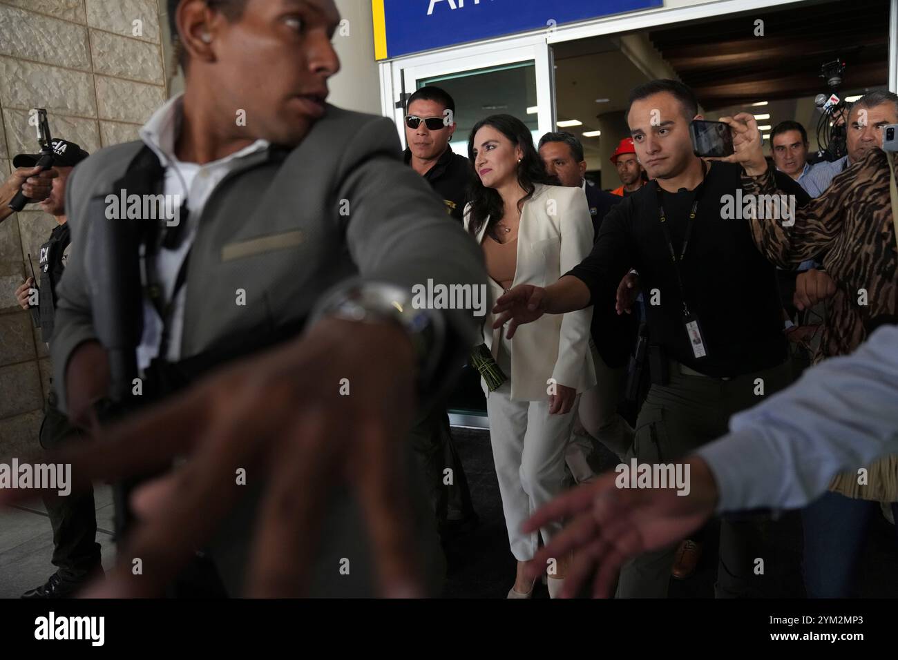 Surrounded by a gaggle of press, Ecuador's suspended Vice President ...