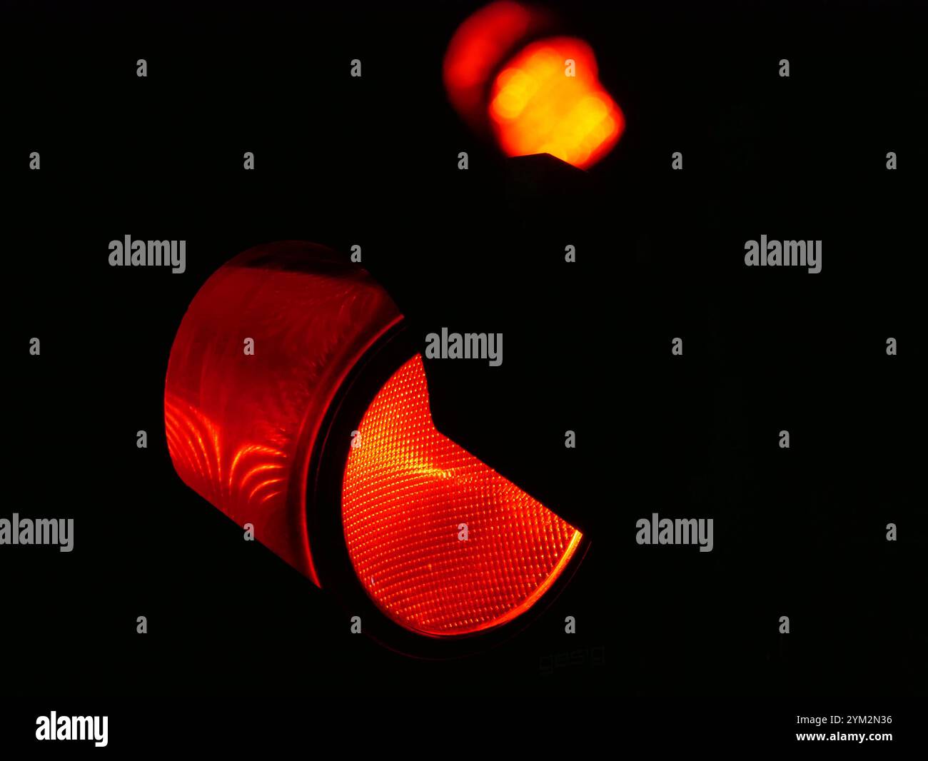 Red traffic light close up in the dark on a black background Stock ...