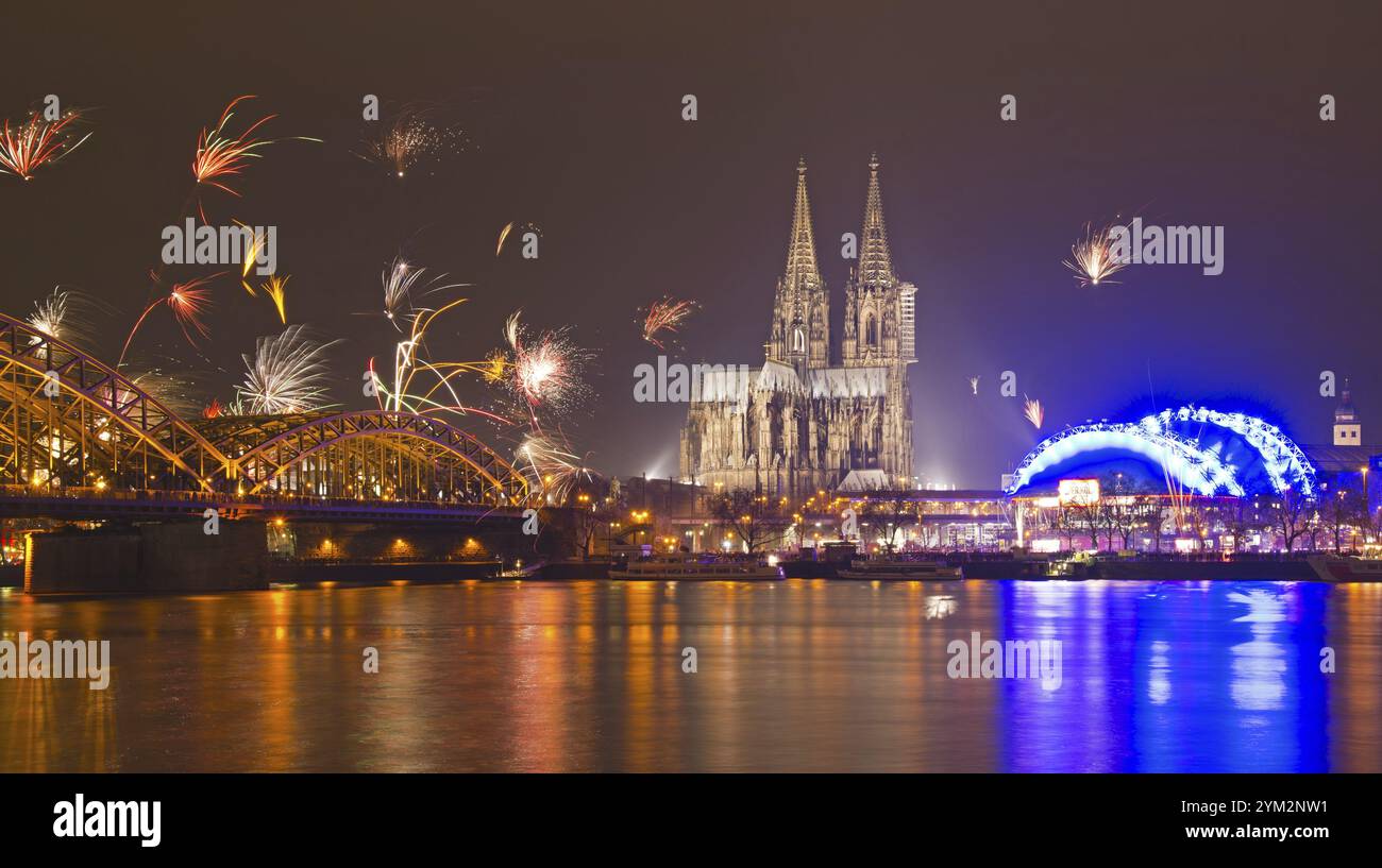 New Year's Eve fireworks, Hohenzollernbruecke with cathedral and ...