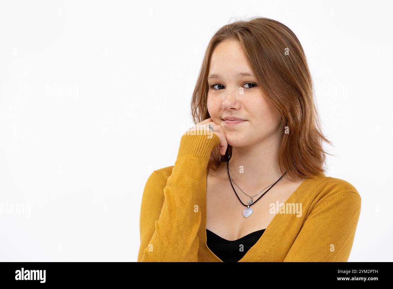 A young woman is depicted in a portrait showcasing a thoughtful and ...
