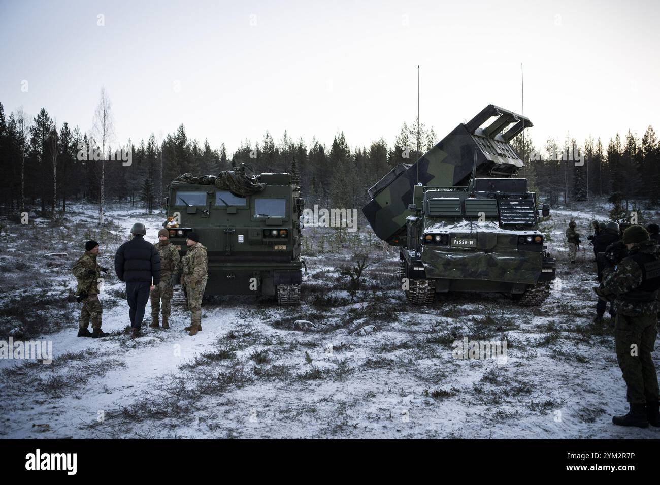 American armored self-propelled multiple launch rocket system (M270 MLRS) at left and at right ...