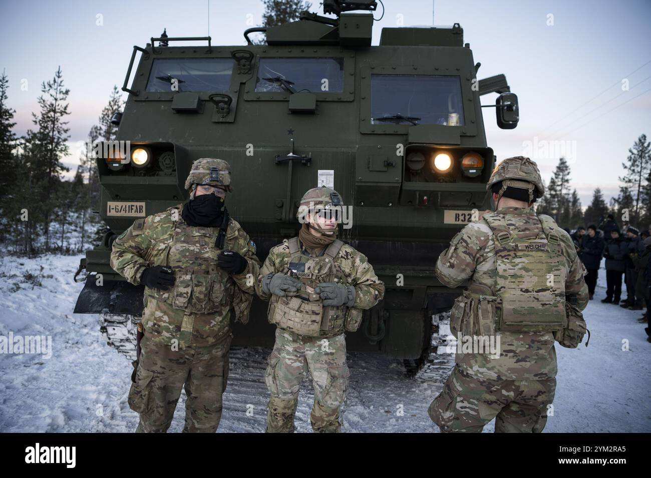 U.S soldiers infront of an American armored self-propelled multiple ...