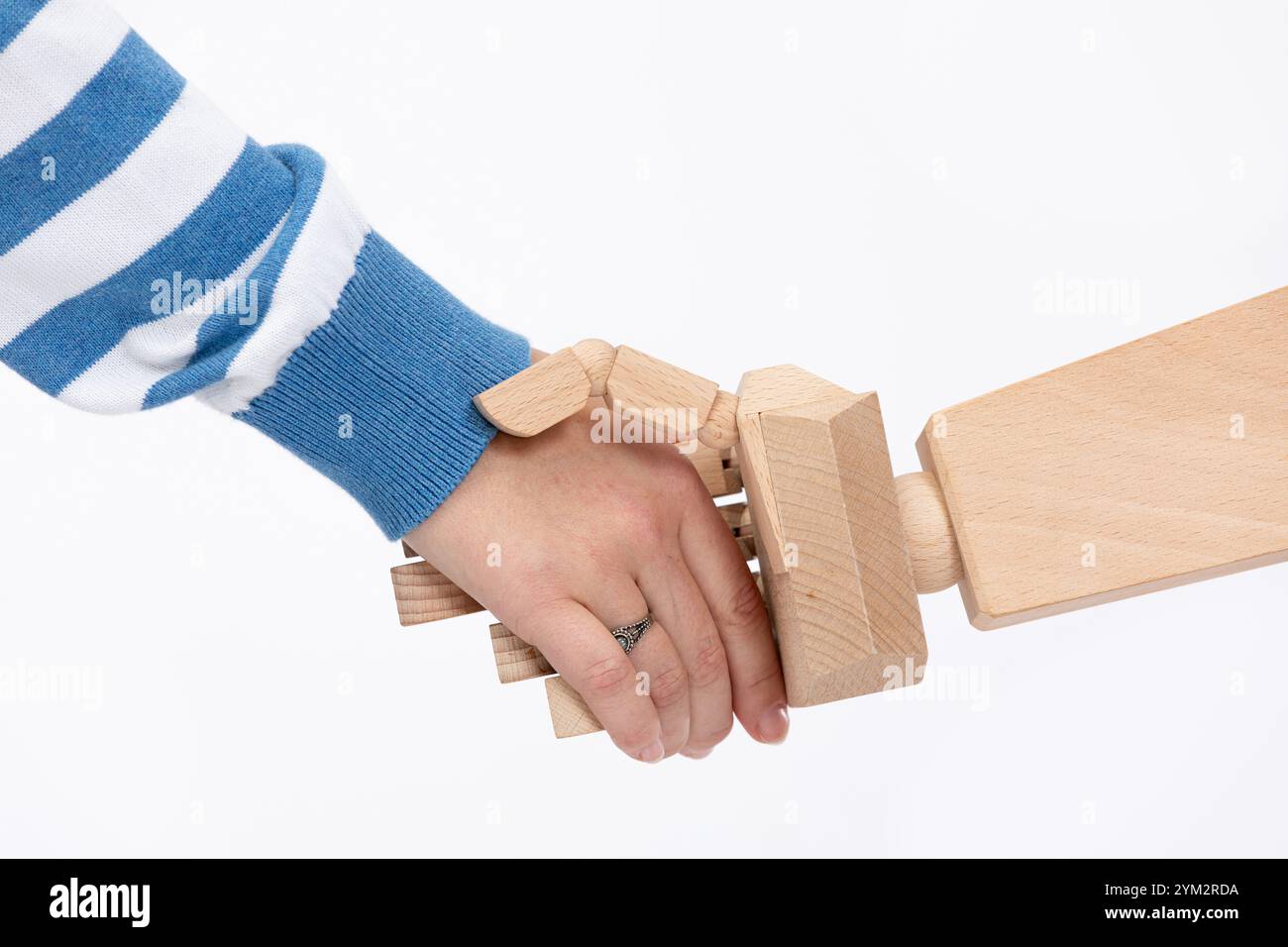 The handshake between humans and robots symbolizes collaboration and ...