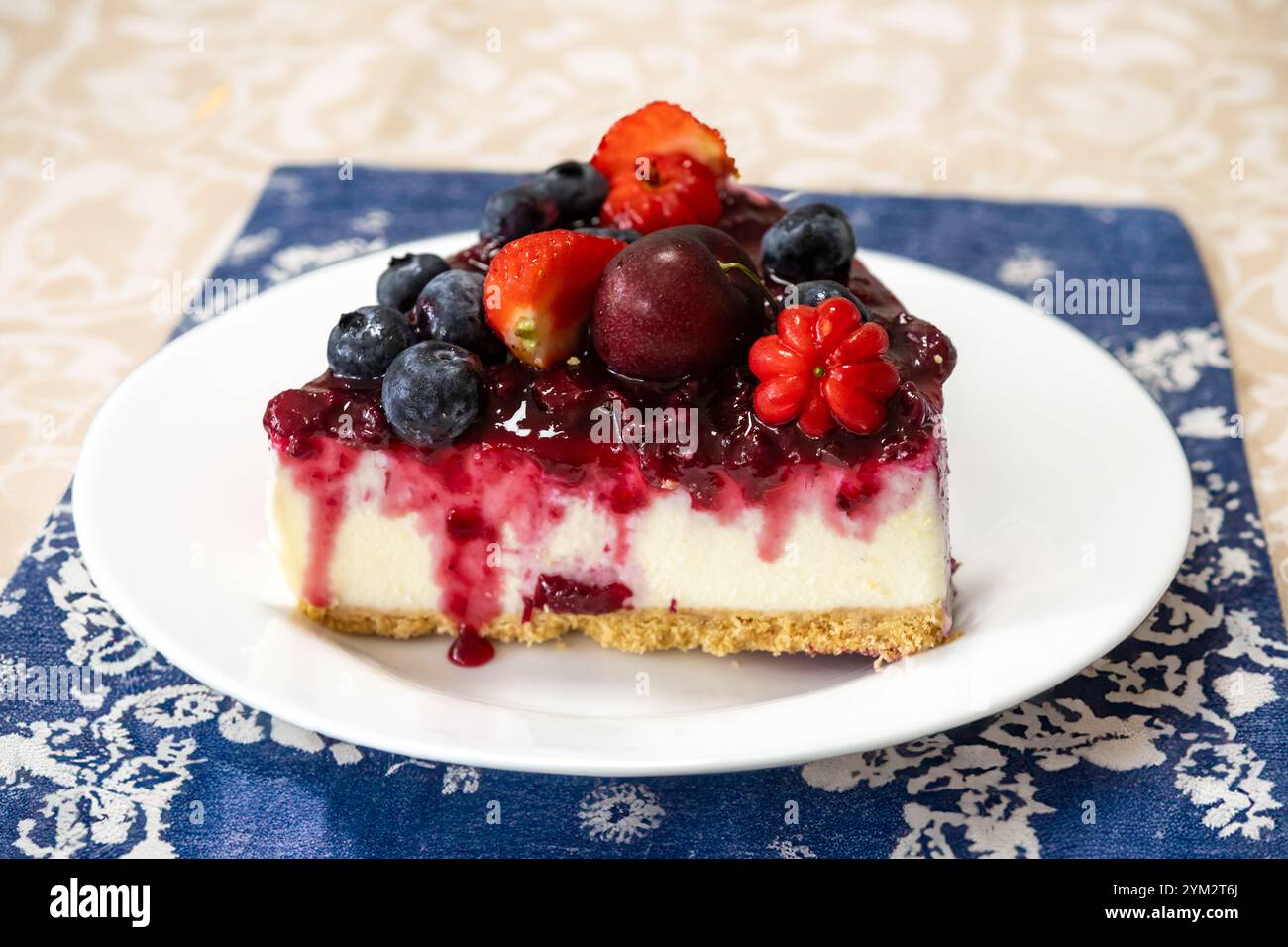 Traditional Christmas red fruit cheesecake with creative and luxurious ...