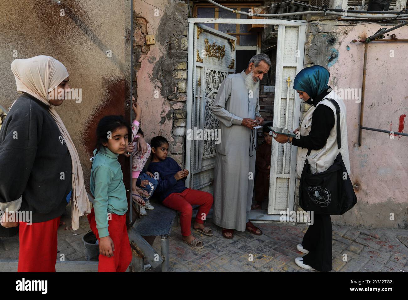 Baghdad, Iraq. 20th Nov, 2024. A field census official collects data ...