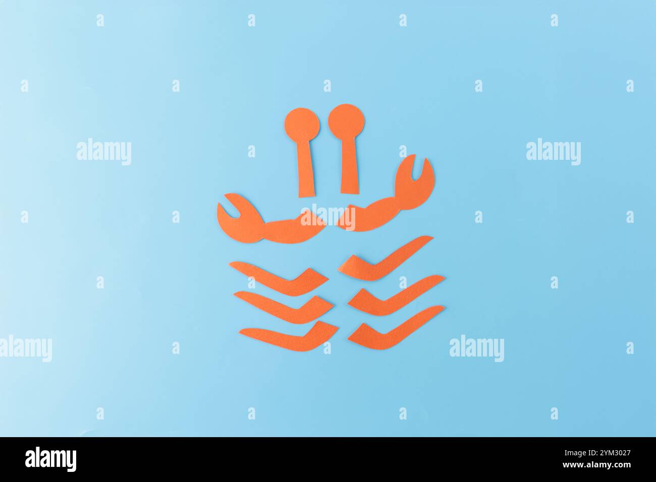 orange paper or cardboard pieces for the legs, claws, and eyes. part of ...