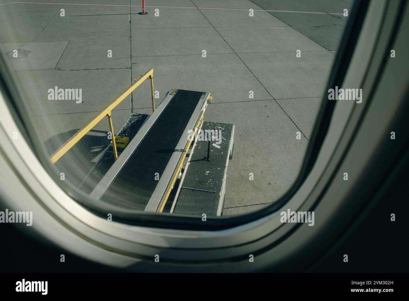 usa, alaska - sep 2 2024 Airplane on runway with luggage ramp. High ...