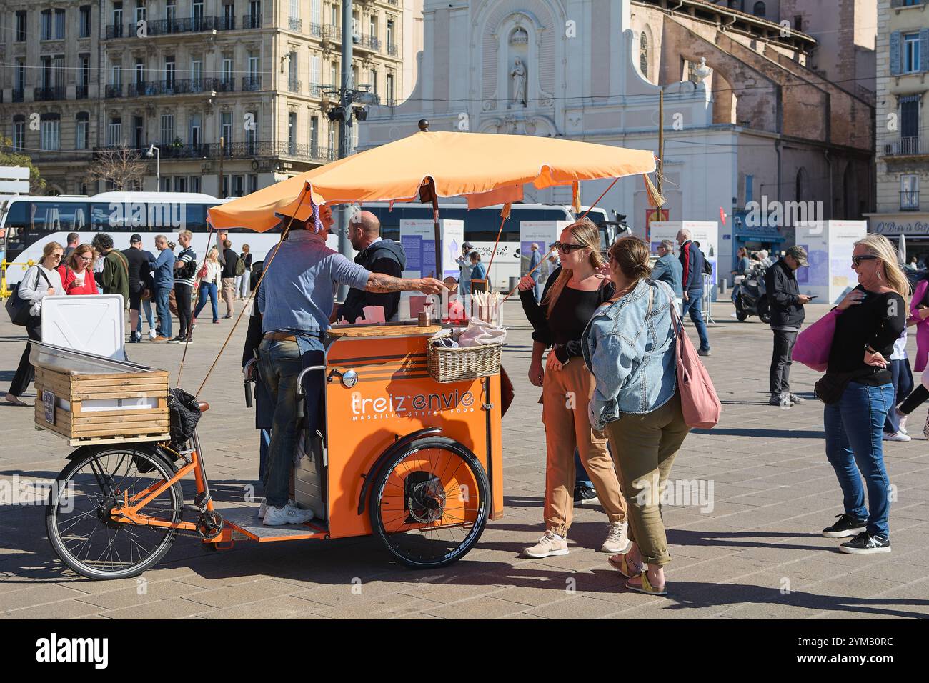 Marseille. France - November 20,2024: A busy food tricycle at Marseille ...