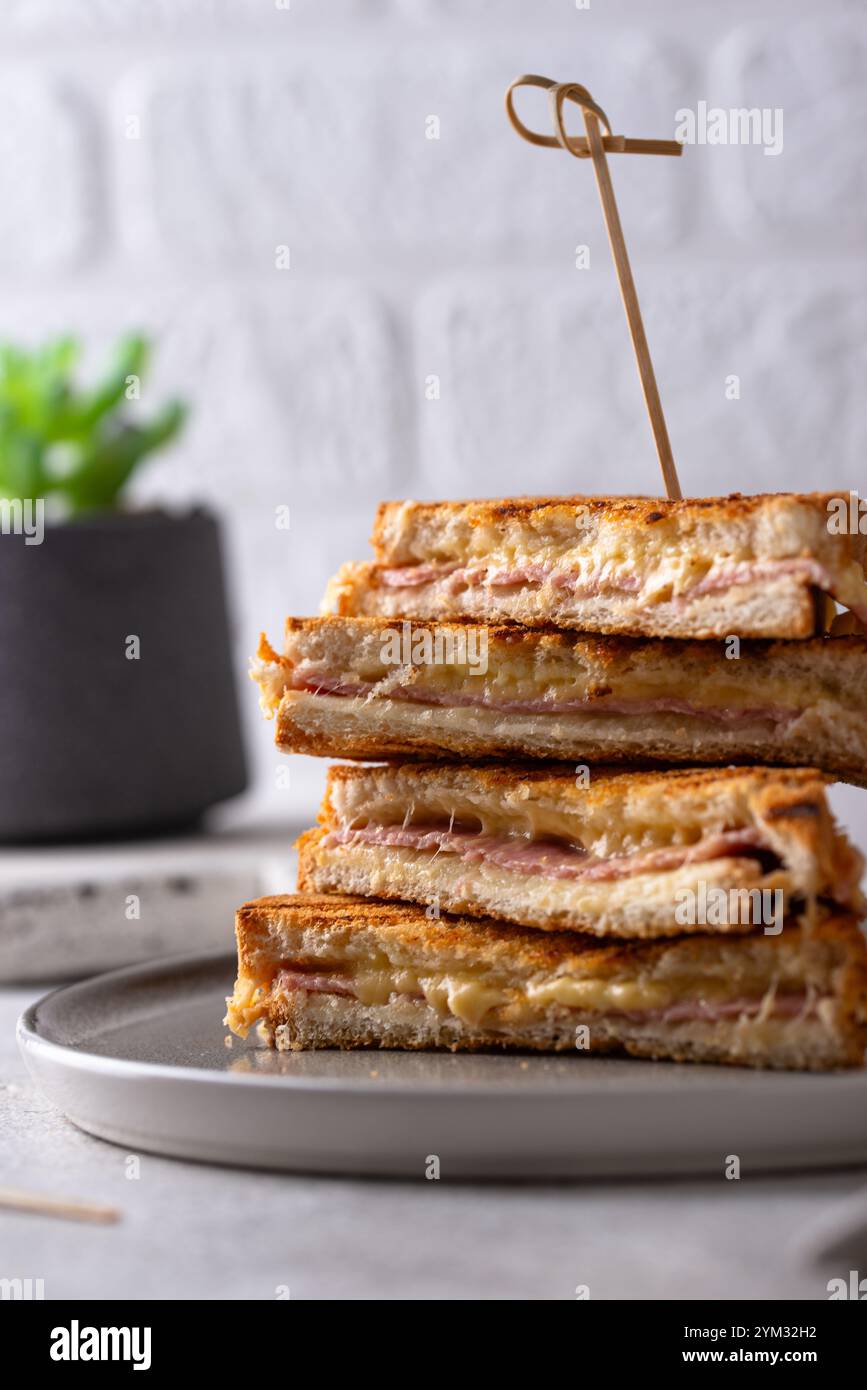 Grilled sandwich with ham and melted cheese Stock Photo - Alamy