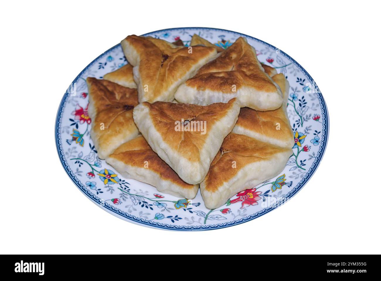 Triangular fried pies with chicken meat and onions on a platter isolate ...