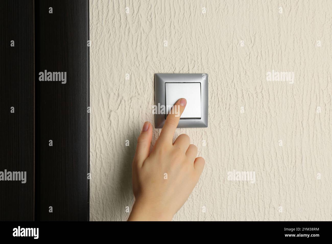 Energy saving light switch woman hi-res stock photography and images ...