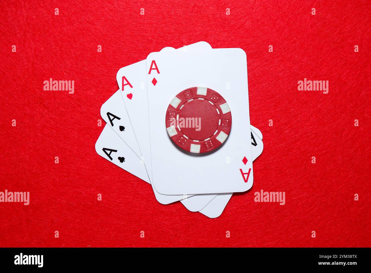 Playing cards and poker chip on red table, top view Stock Photo - Alamy