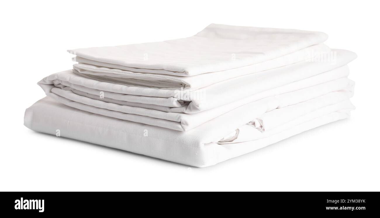 Stacked clean bed linens on white background Stock Photo - Alamy