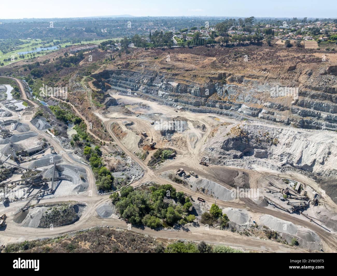 Aerial view of industrial sand and gravel quarry open-pit mining site ...