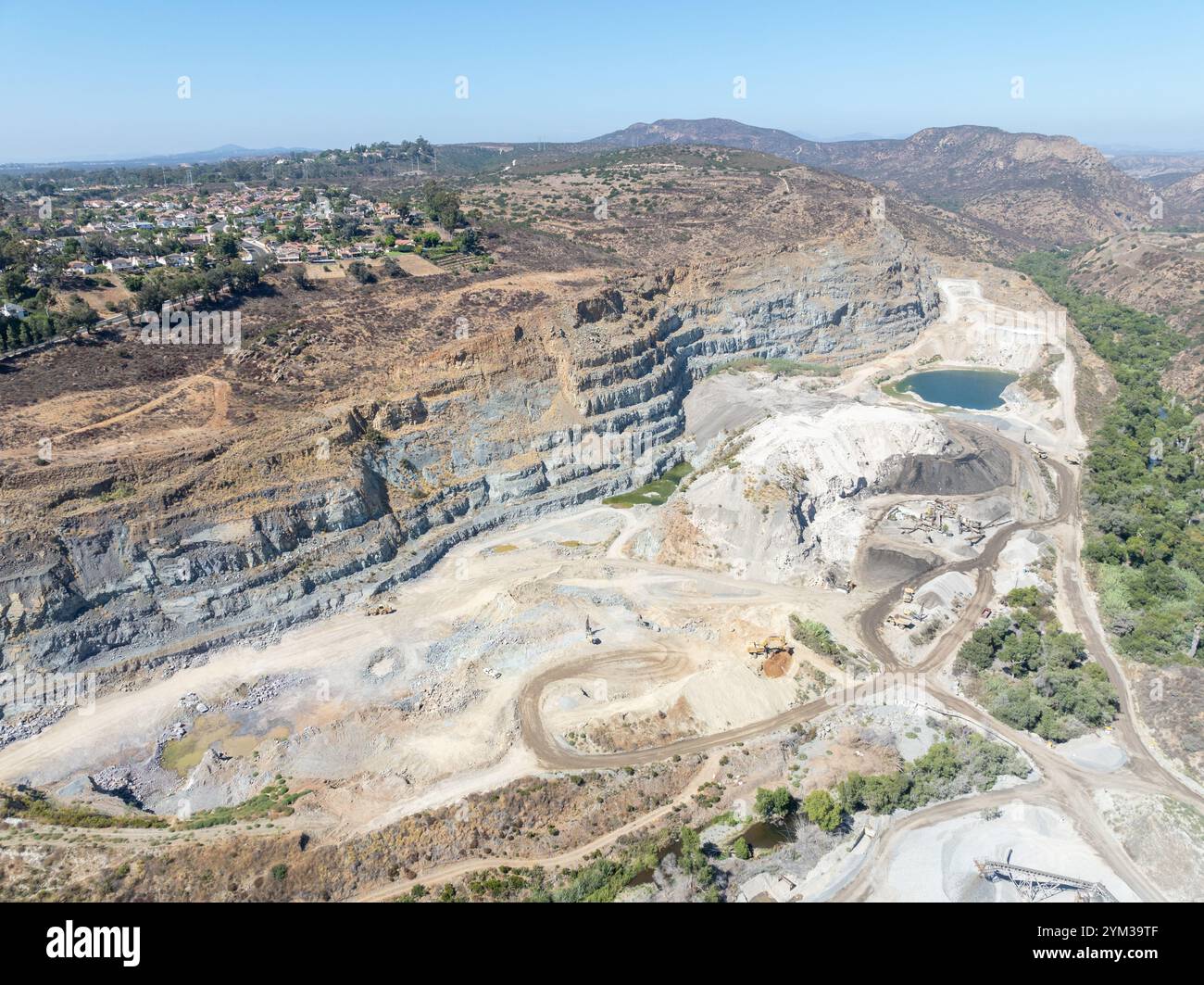 Aerial view of industrial sand and gravel quarry open-pit mining site ...
