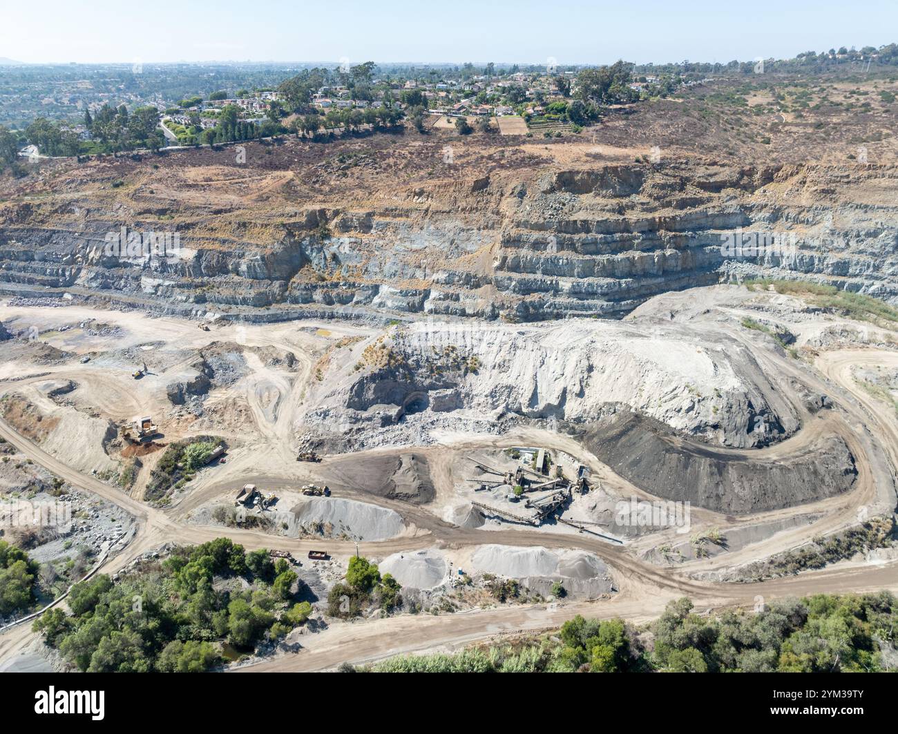 Aerial view of industrial sand and gravel quarry open-pit mining site ...