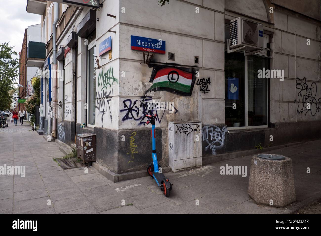 Street view with facade and flying flag in Praga district, a developing ...