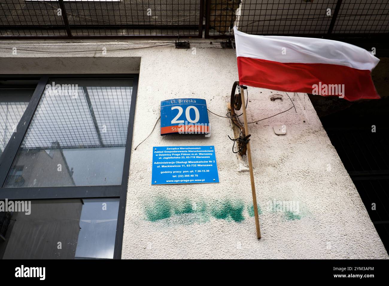 Street view with facade and flying flag in Praga district, a developing ...
