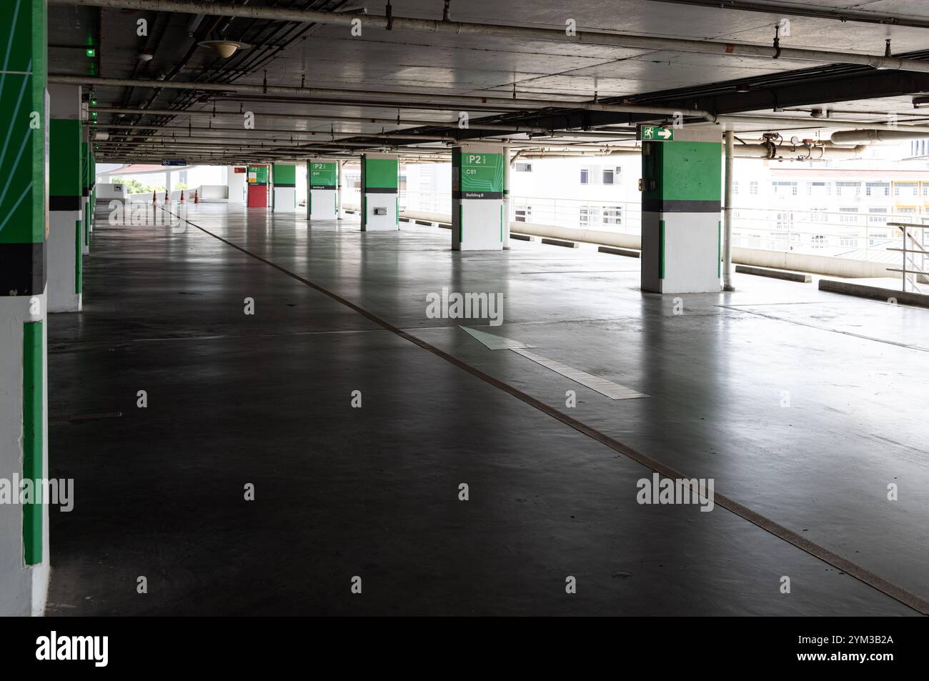 Dimly lit empty parking garage, Parking lot with empty places Stock ...