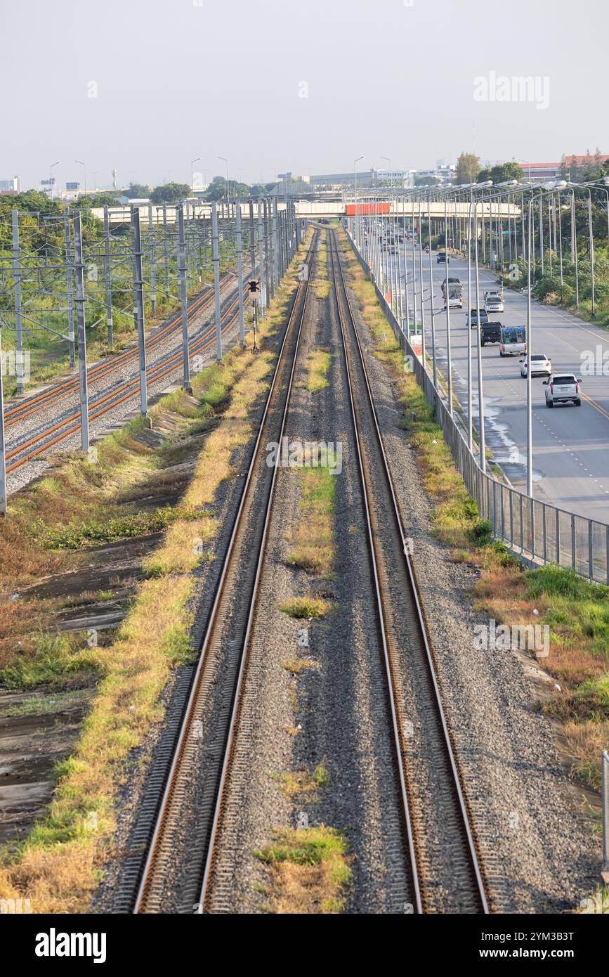 double-track railroad railway or train tracks in suburb train station, travel and transportation ...