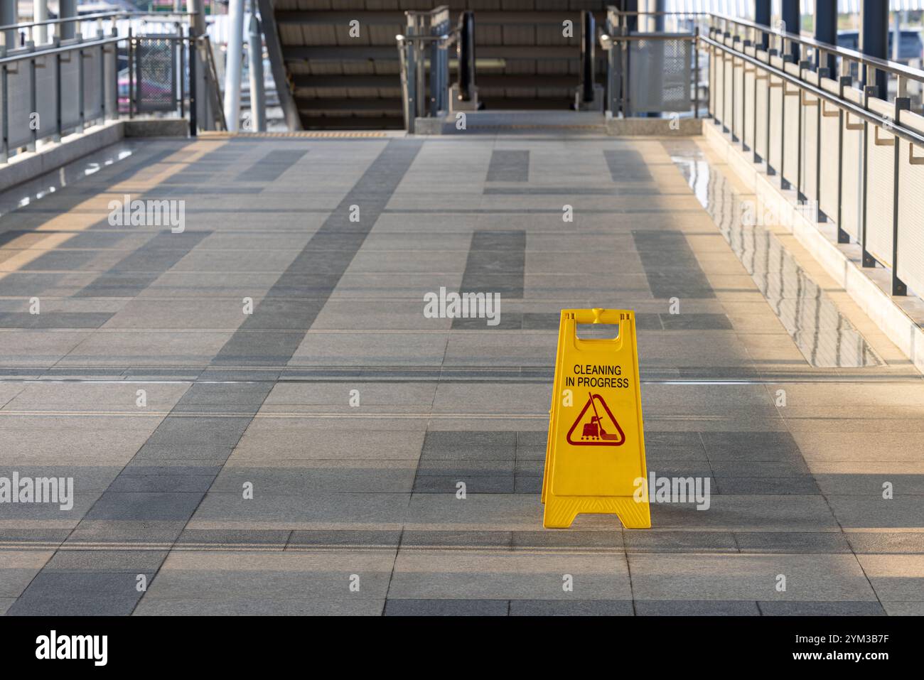 Sign showing warning of cleaning process area, Yellow sign that alerts ...