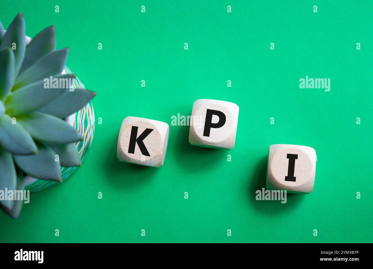 KPI- Key Performance Indicator. Wooden cubes with word KPI. Beautiful ...