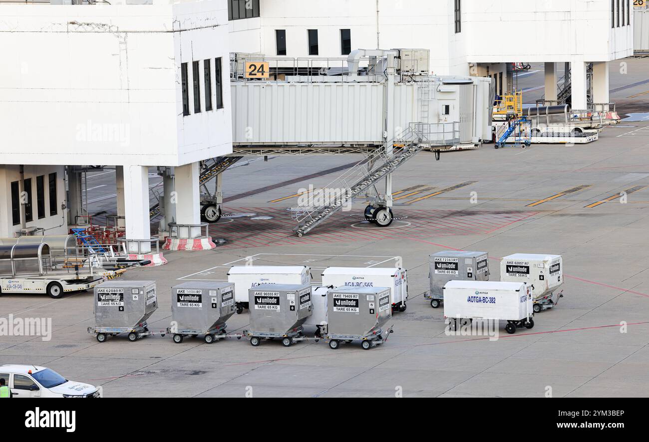 Airport Baggage Tug (baggage dolly transport) on standby in ground ...