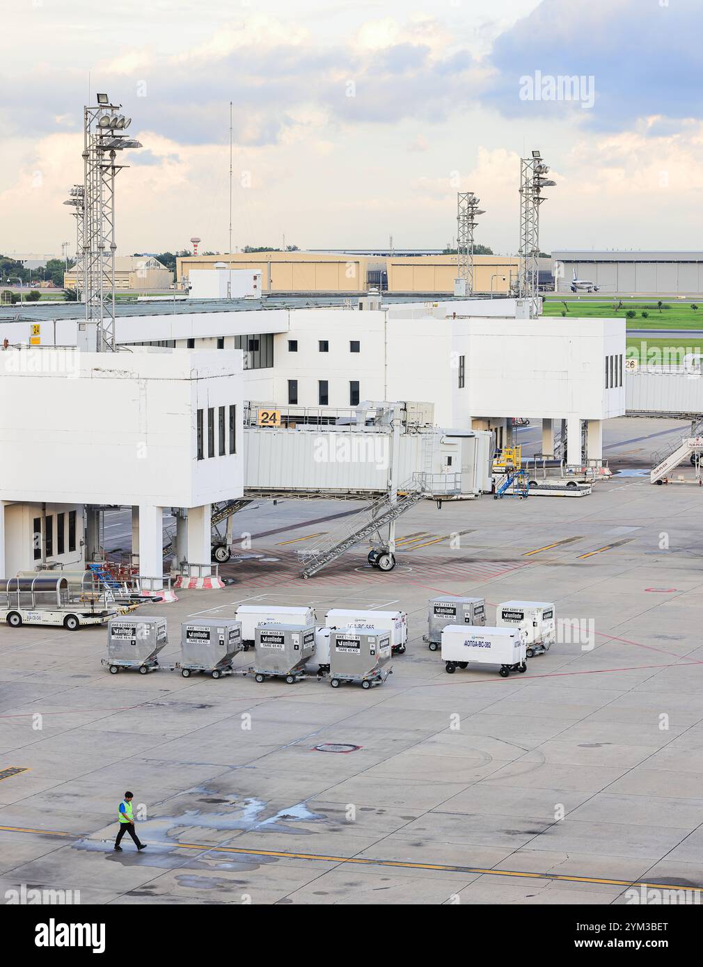 Airport Baggage Tug (baggage dolly transport) on standby in ground ...