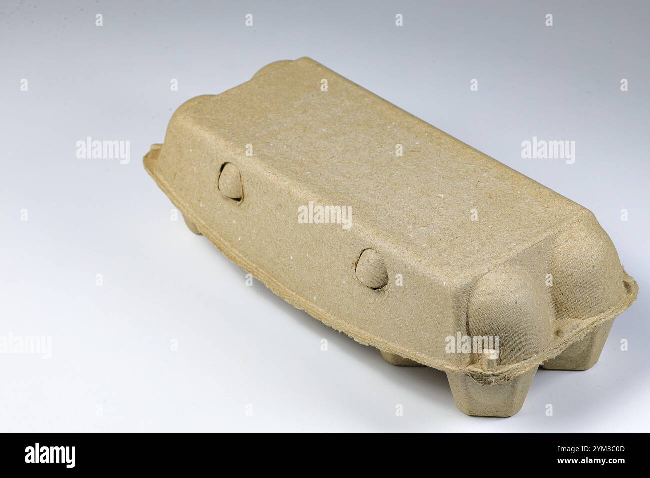 Egg box Made from recycle material in nature light isolated in white ...