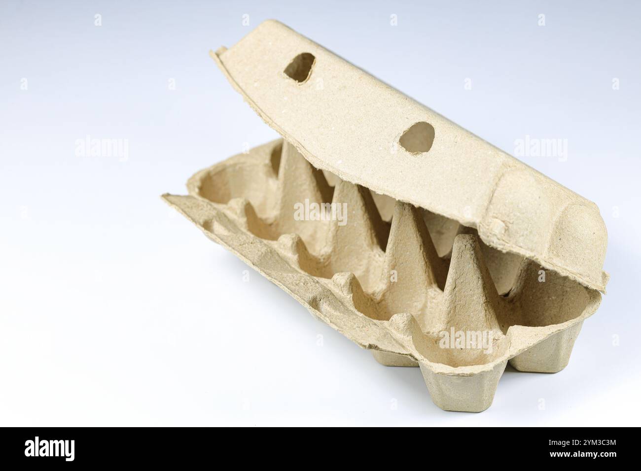 Egg box Made from recycle material in nature light isolated in white ...