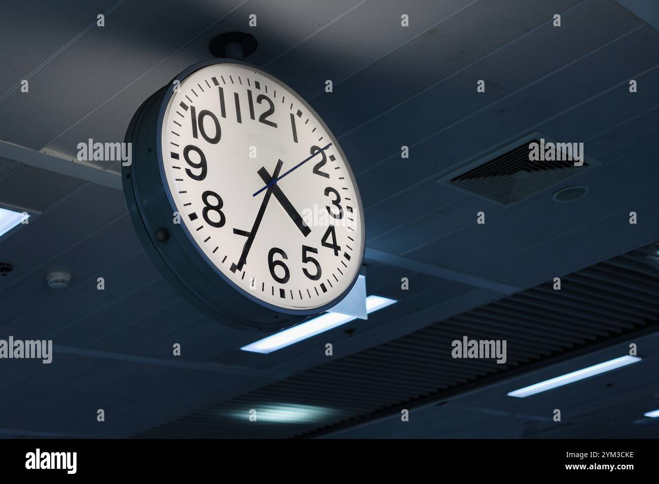 Clock at train station. A large clock faces public transport on a train ...