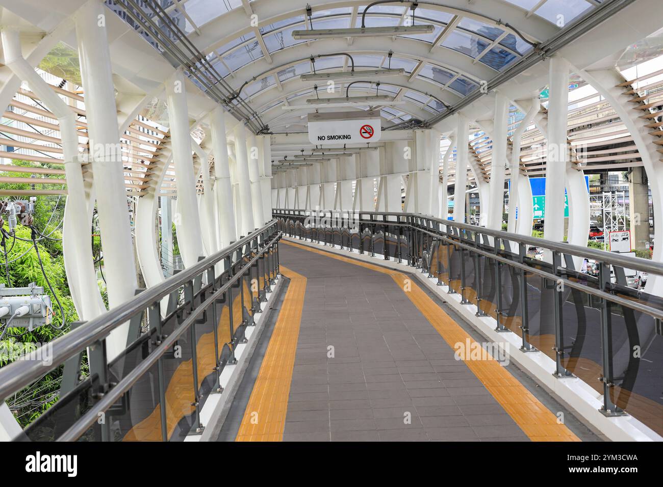 Pedestrian pathway or corridor or hallway between train station and ...