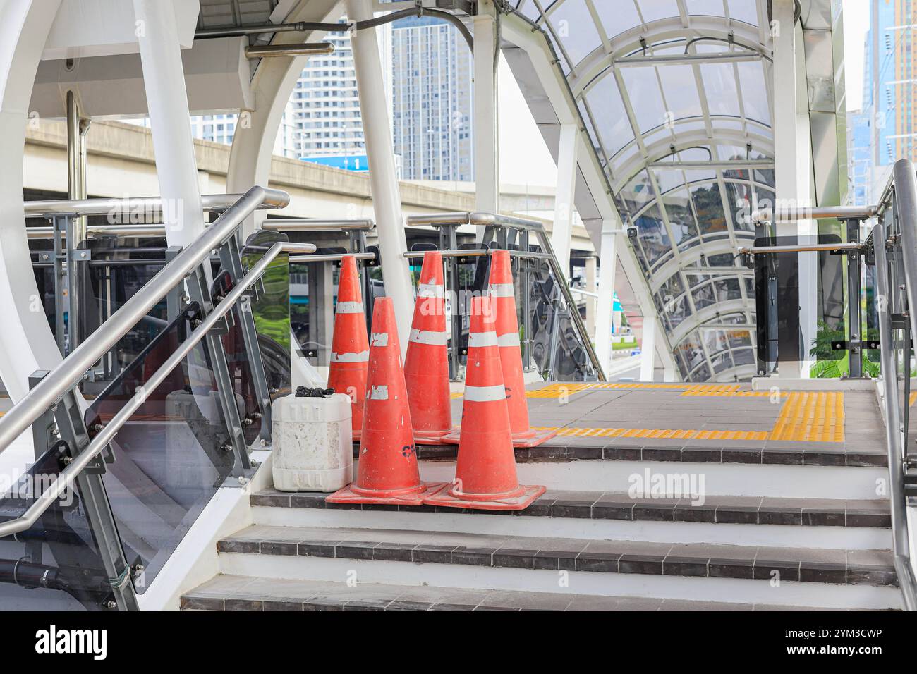 Pile of orange fluorescent, reflex traffic cones on Pedestrian pathway ...