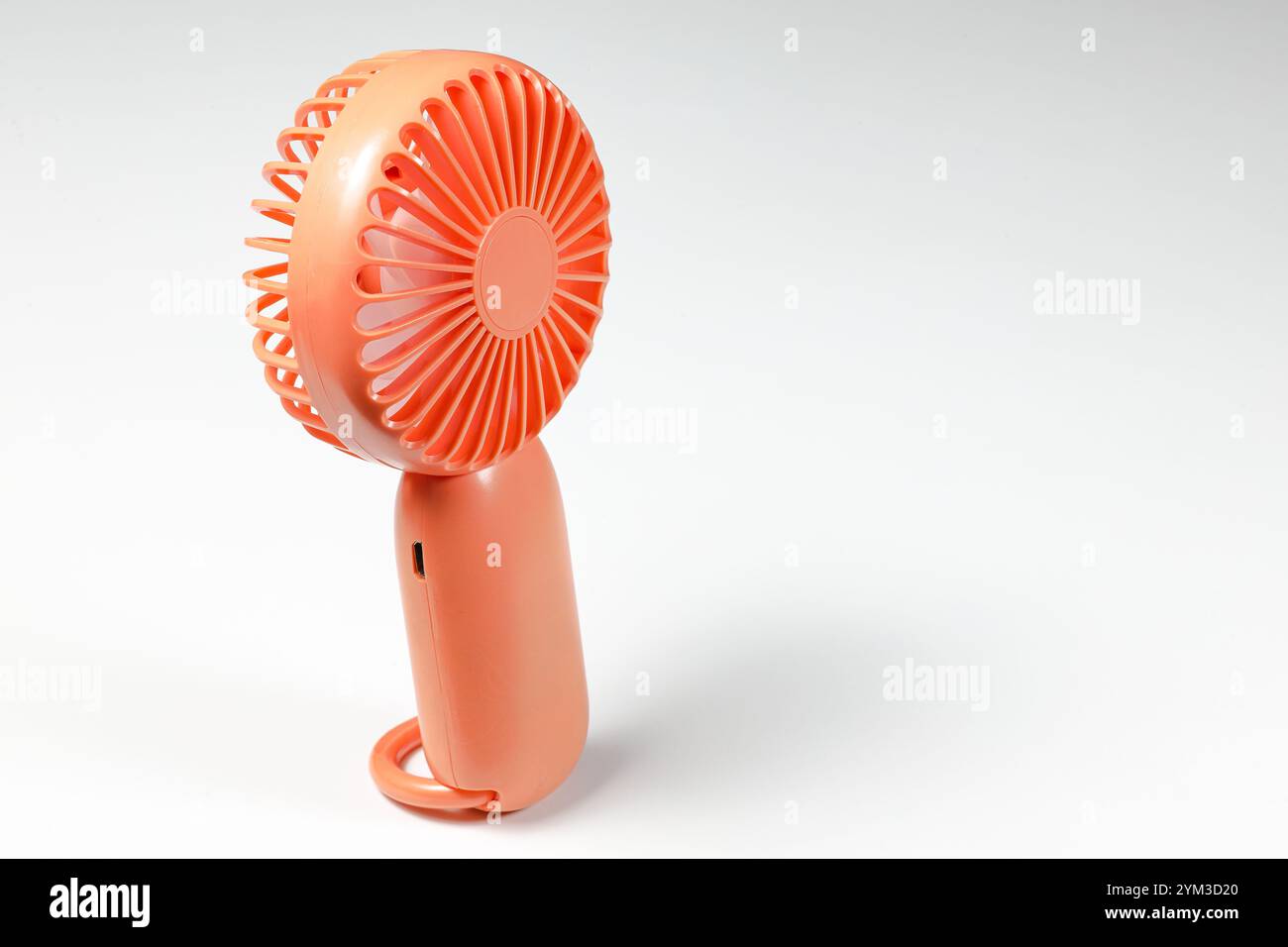 Small plastic Portable fan side view, isolated on white background ...