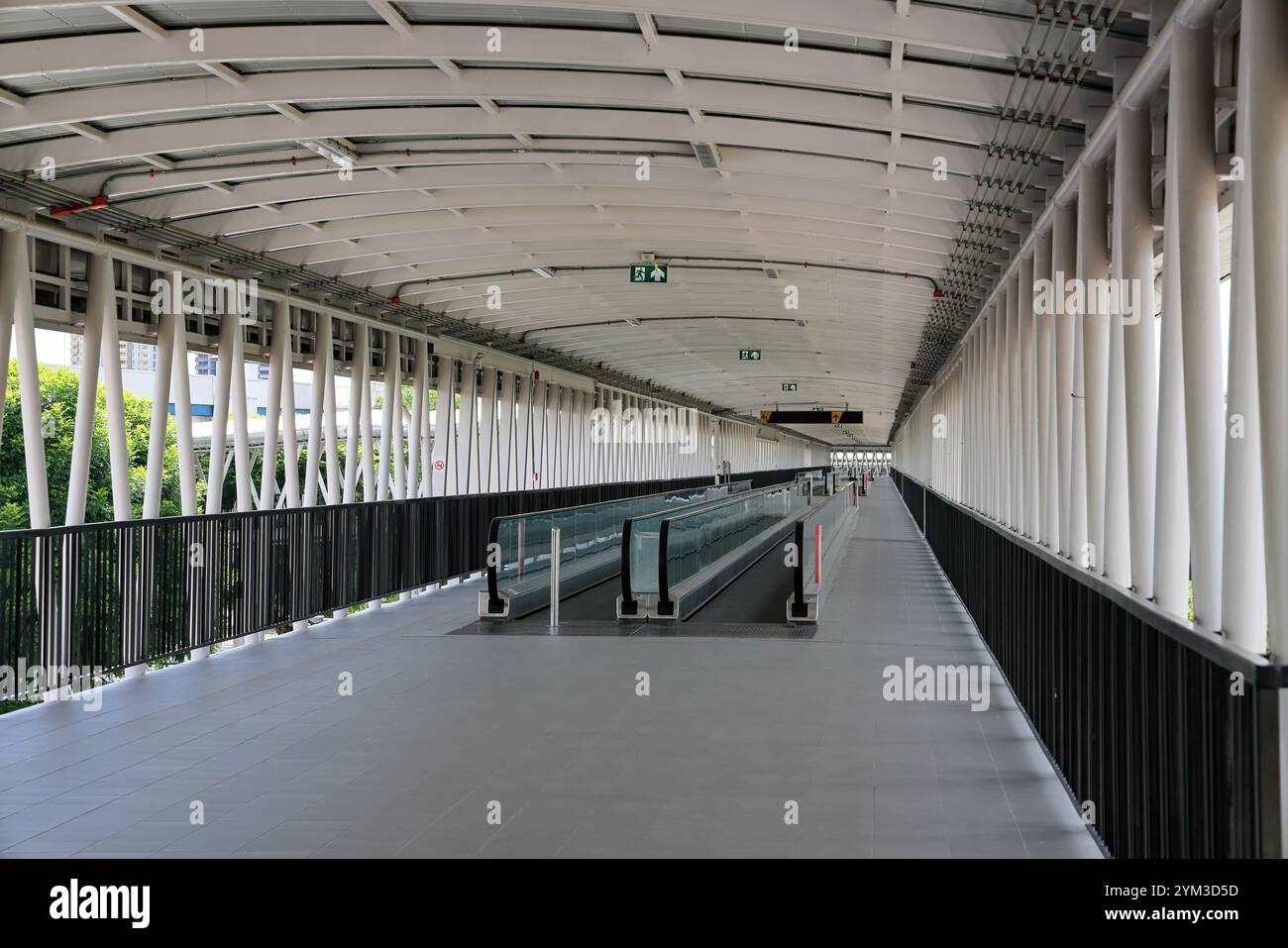 Pedestrian pathway or corridor or hallway between train station and ...