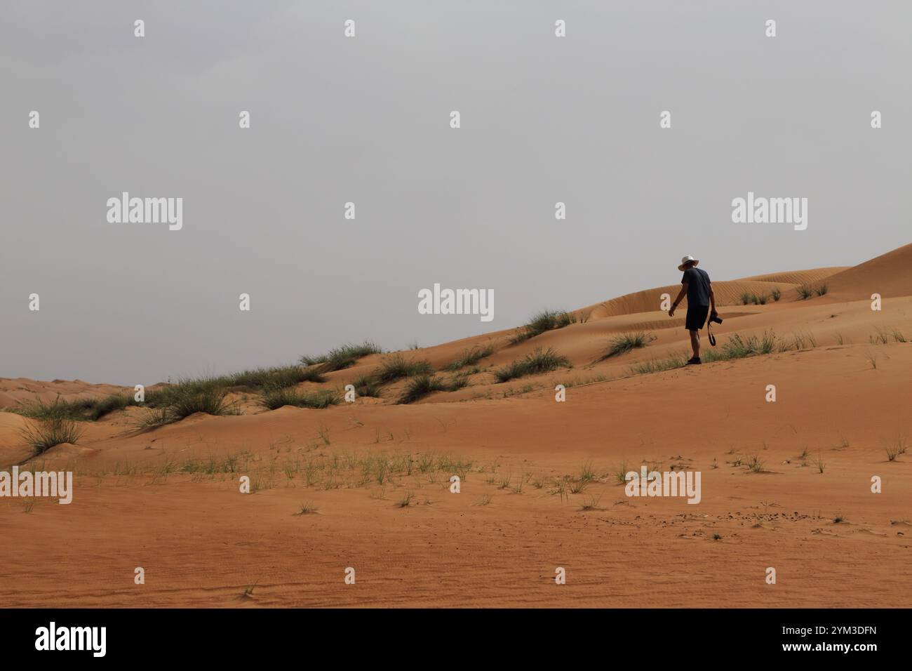 Tourist With Camera on Sand Dunes Wahiba Sand Oman Stock Photo - Alamy