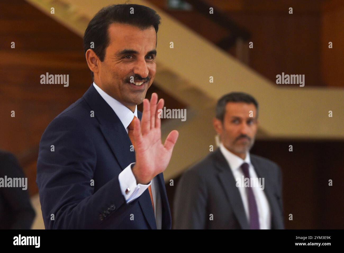 Qatar's Emir Sheikh Tamim bin Hamad al-Thani waves upon his arrival to ...