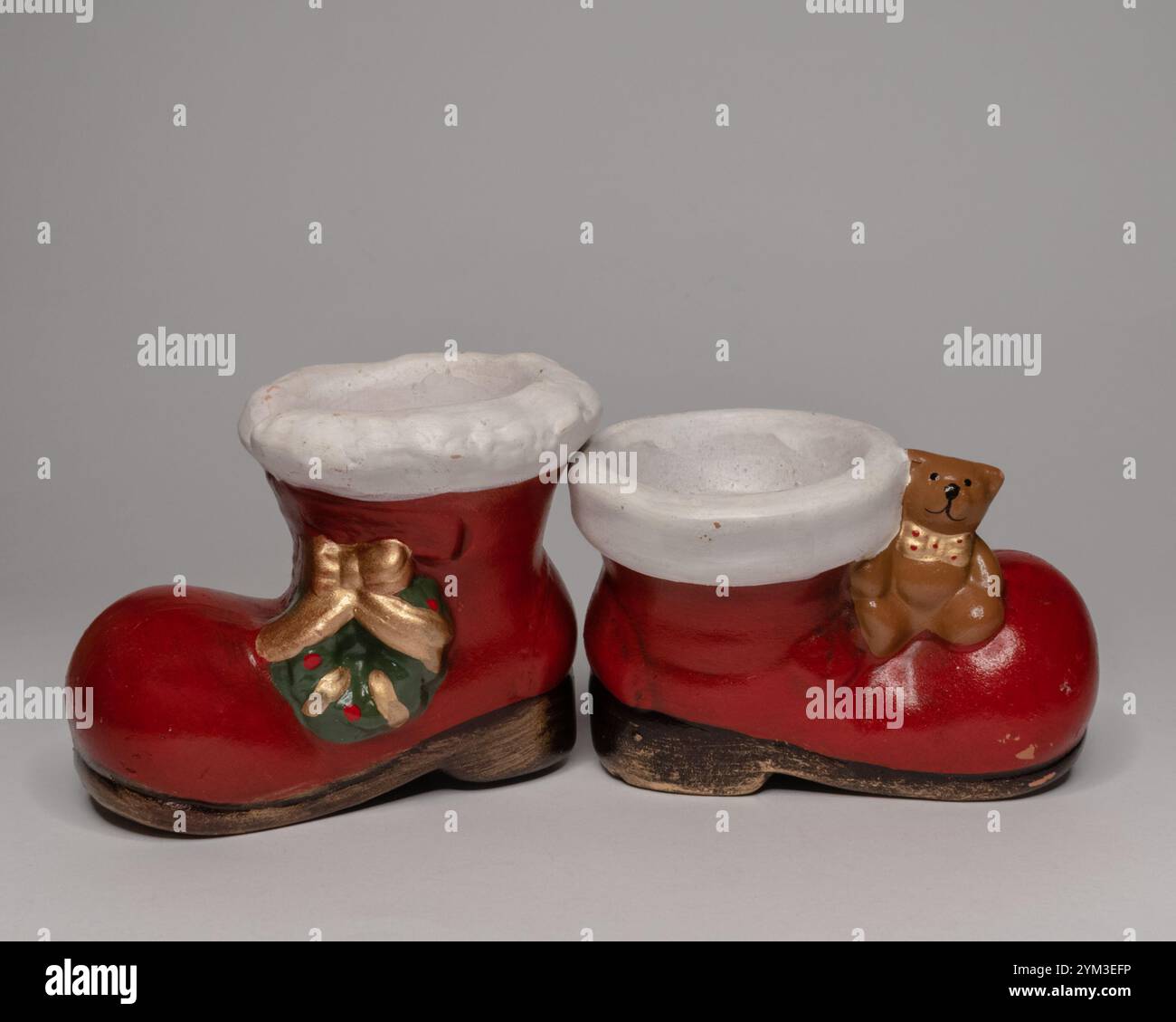 Ceramic santa boots with small bear and wreath. Christmas concept Stock ...
