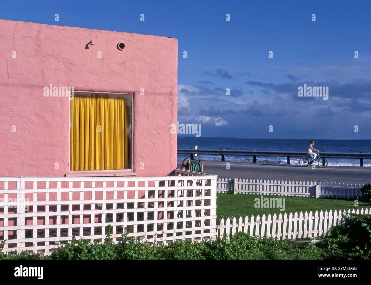 House with pink stucco exterior near the ocean on the California coast ...
