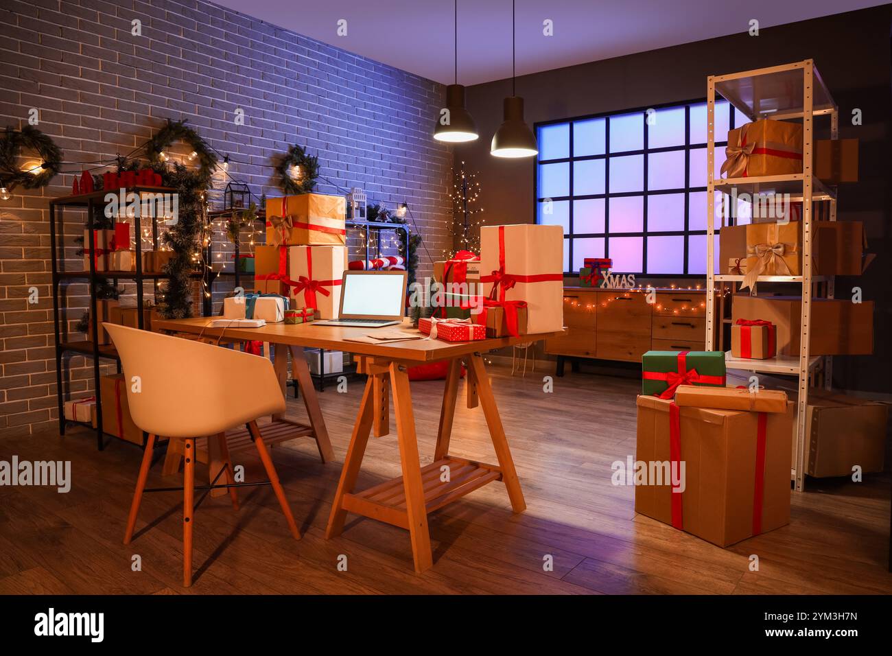 Interior of post office with gift boxes, blank laptop and Christmas ...