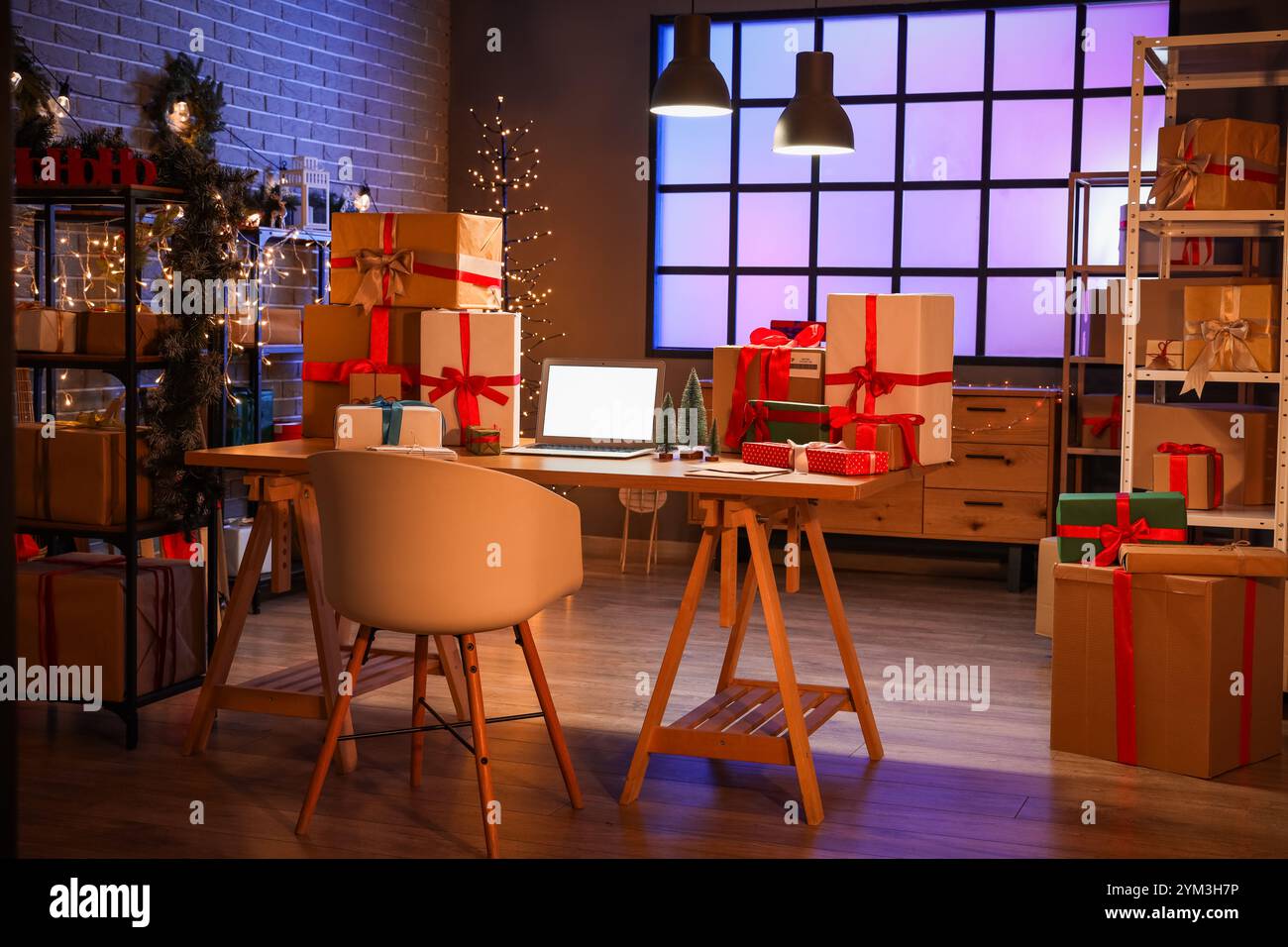 Interior of post office with gift boxes, blank laptop and Christmas ...