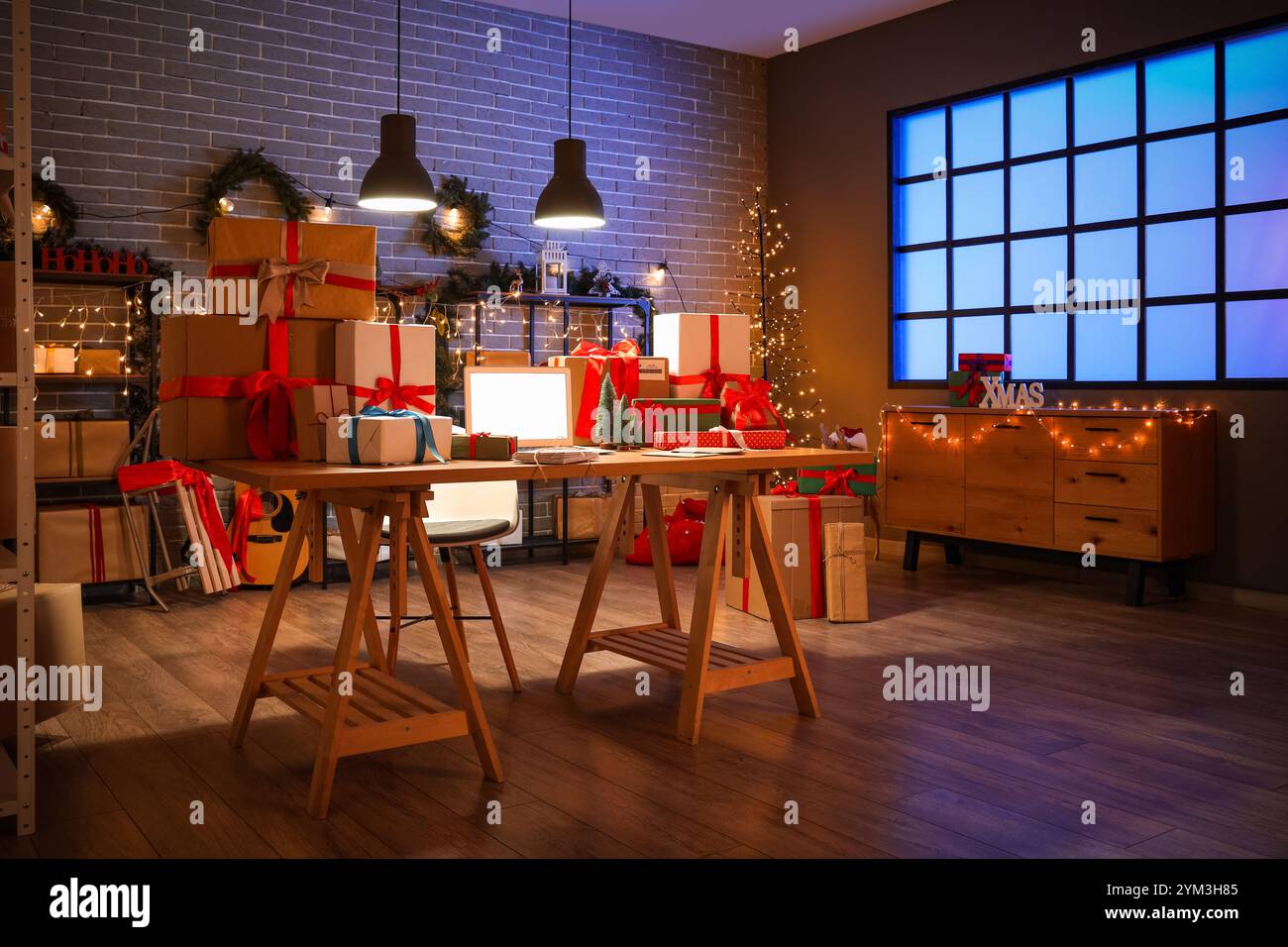 Interior of post office with gift boxes, blank laptop and Christmas ...