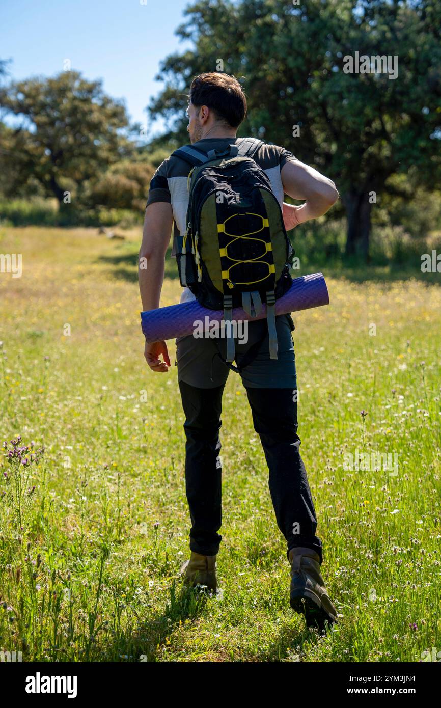 Adventurous young man hiking hi-res stock photography and images - Alamy