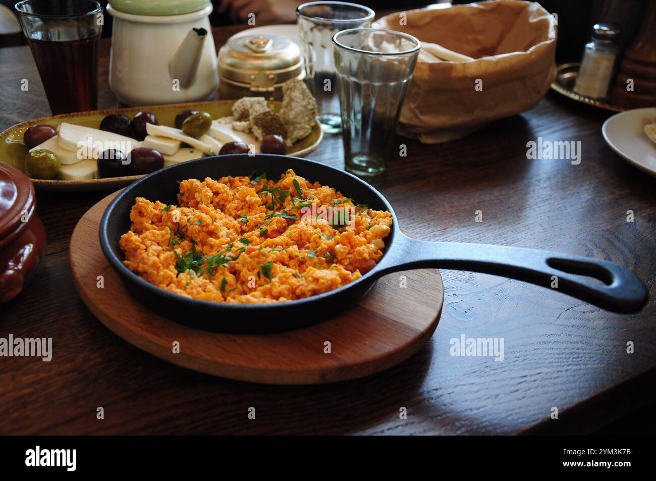 A Shakshuka is an Arabic dish contain fried eggs mixed with tomato ...