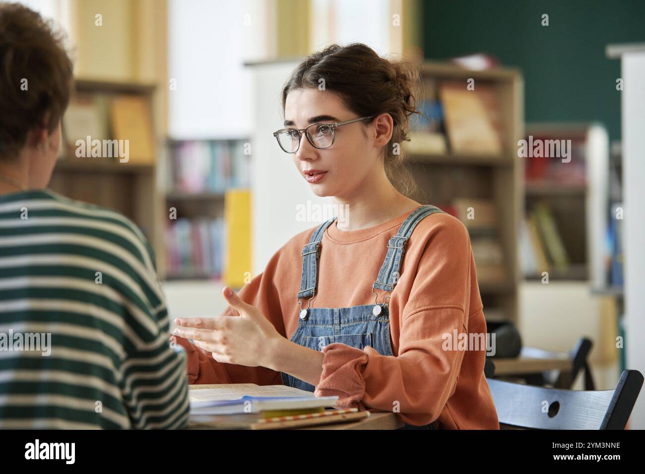 Engaging in Discussion at Library Study Session Stock Photo - Alamy
