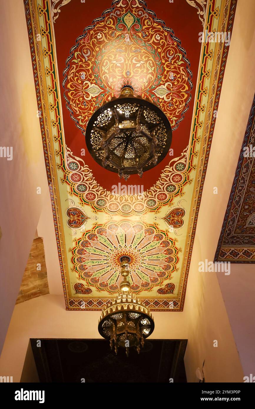 Anna, Valencia, Spain- October 27, 2024: Wrought iron lamp and Ceiling ...