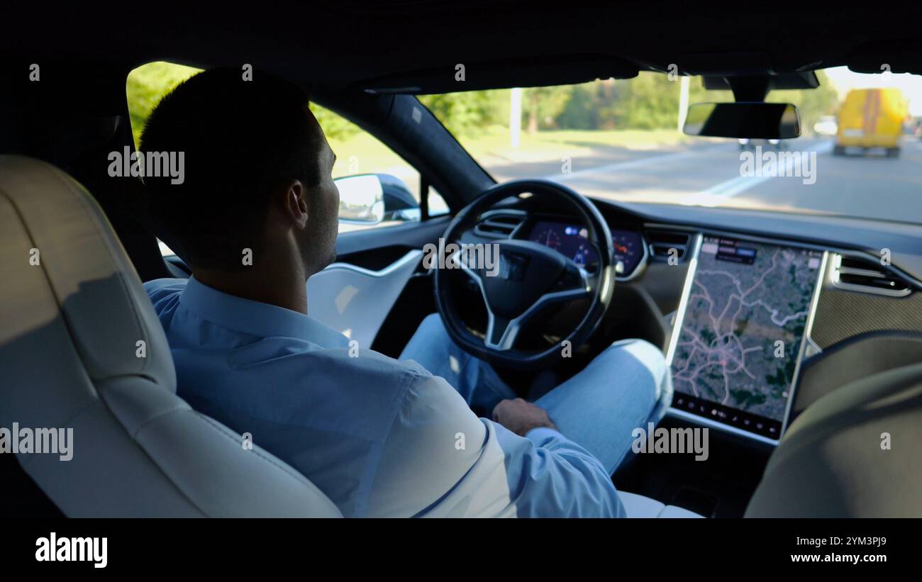 Male businessperson experience to ride an autonomous self driving ...