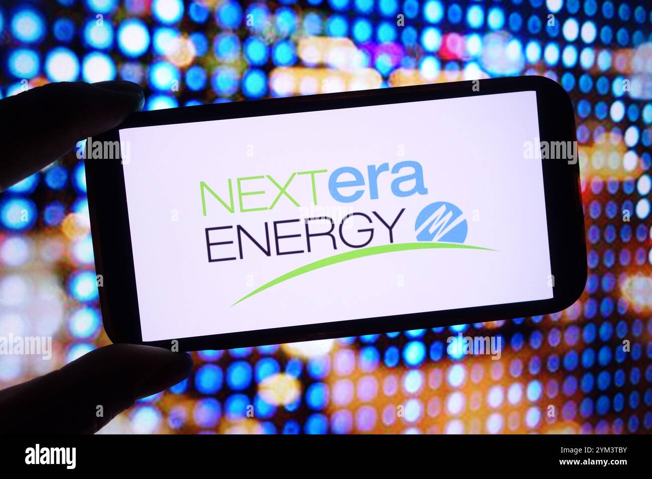 In this photo illustration, the Nextera Energy company logo is seen ...